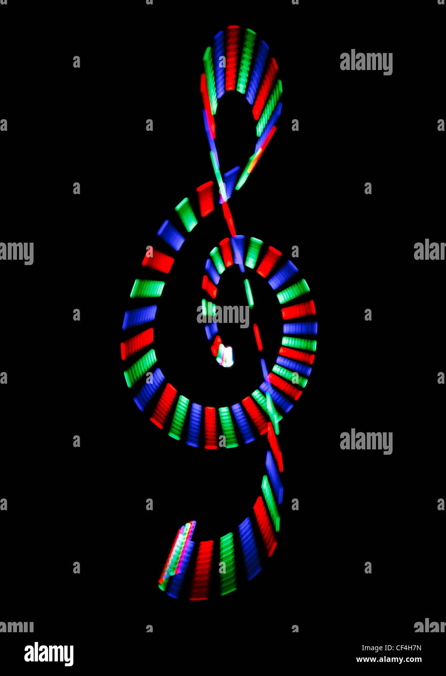 Multi-coloured shone treble clef on black background. Musical symbol ...