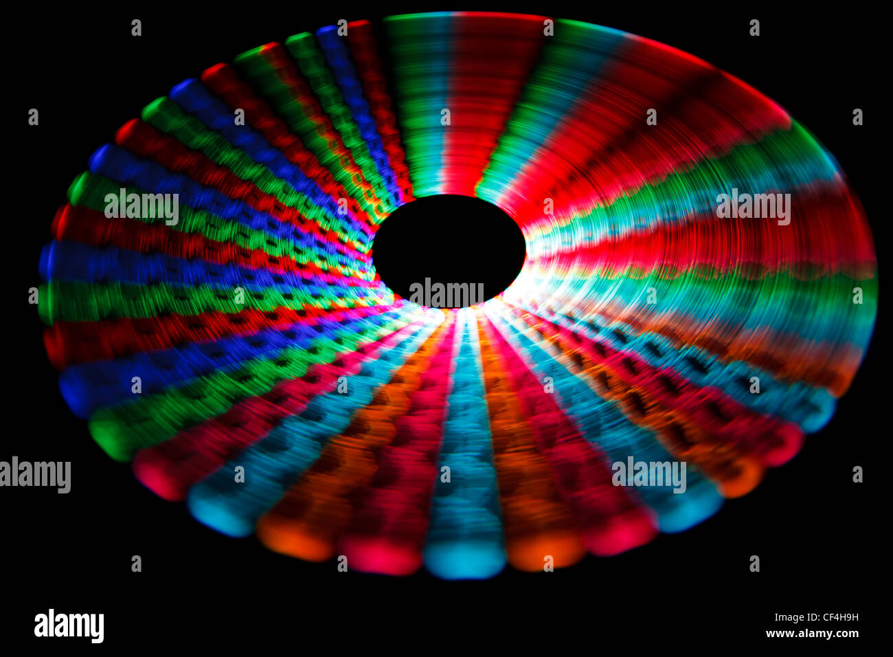 Colorful glowing trail rotating LED, in form of a disc. Isolated on ...