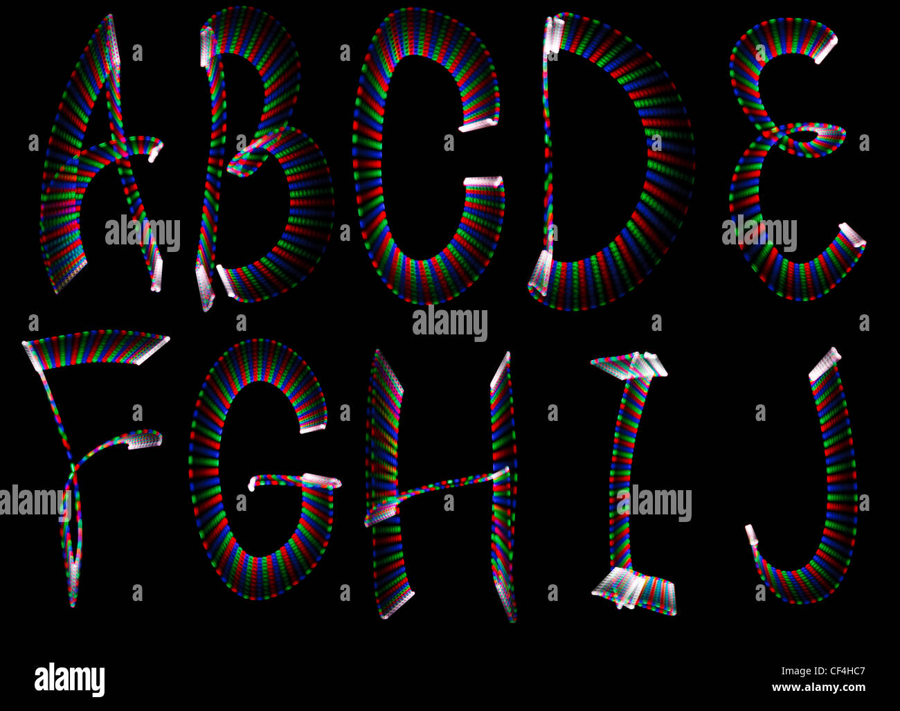 Bright rainbow letters, part of english alphabet on black background ...