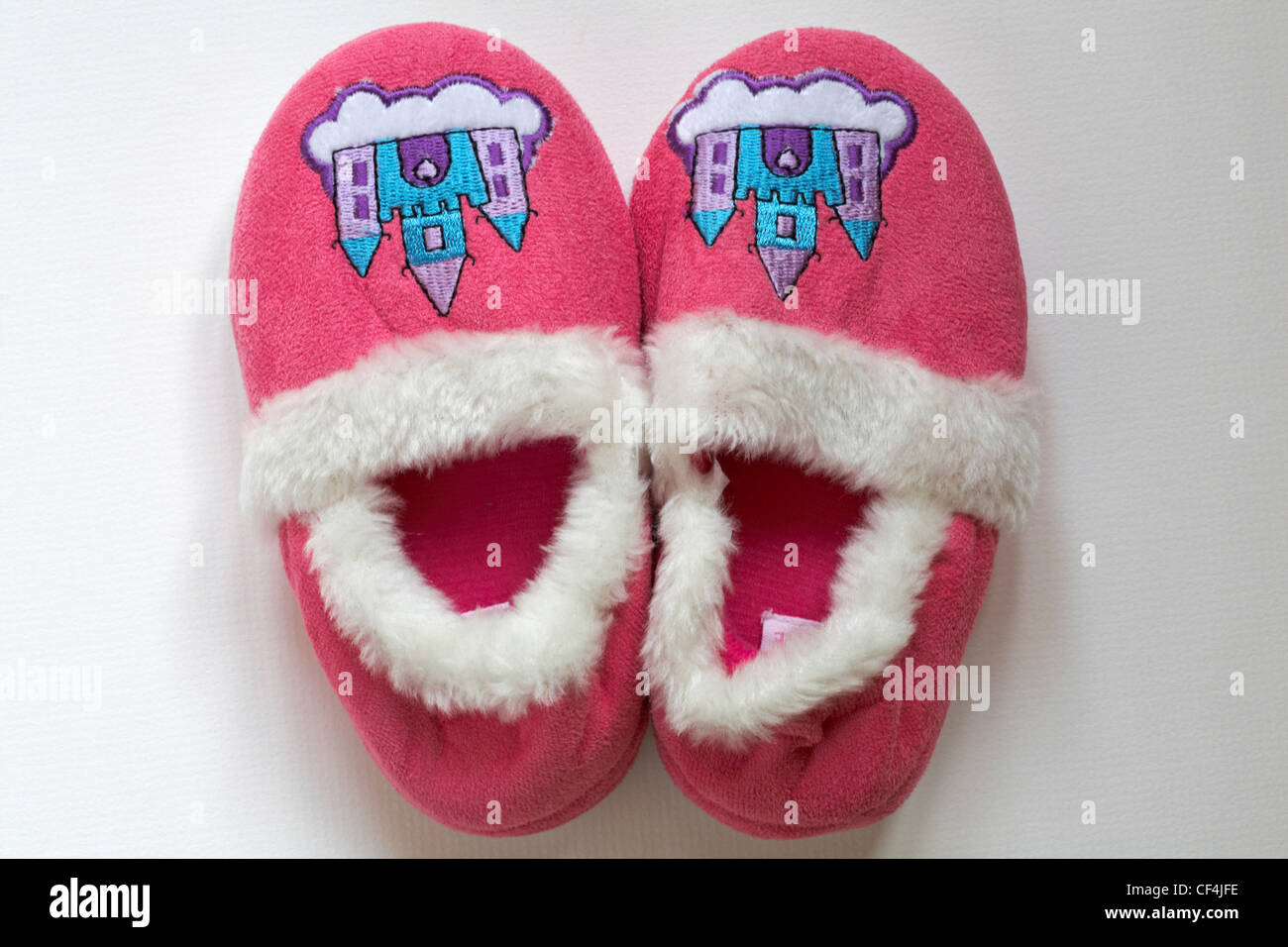 girls pink slippers with fairy castle on isolated on white background ...