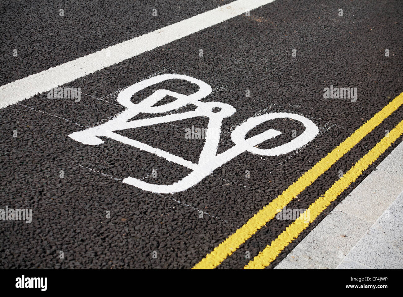 markings for cycle lane and double yellow lines on tarmaced road Stock ...