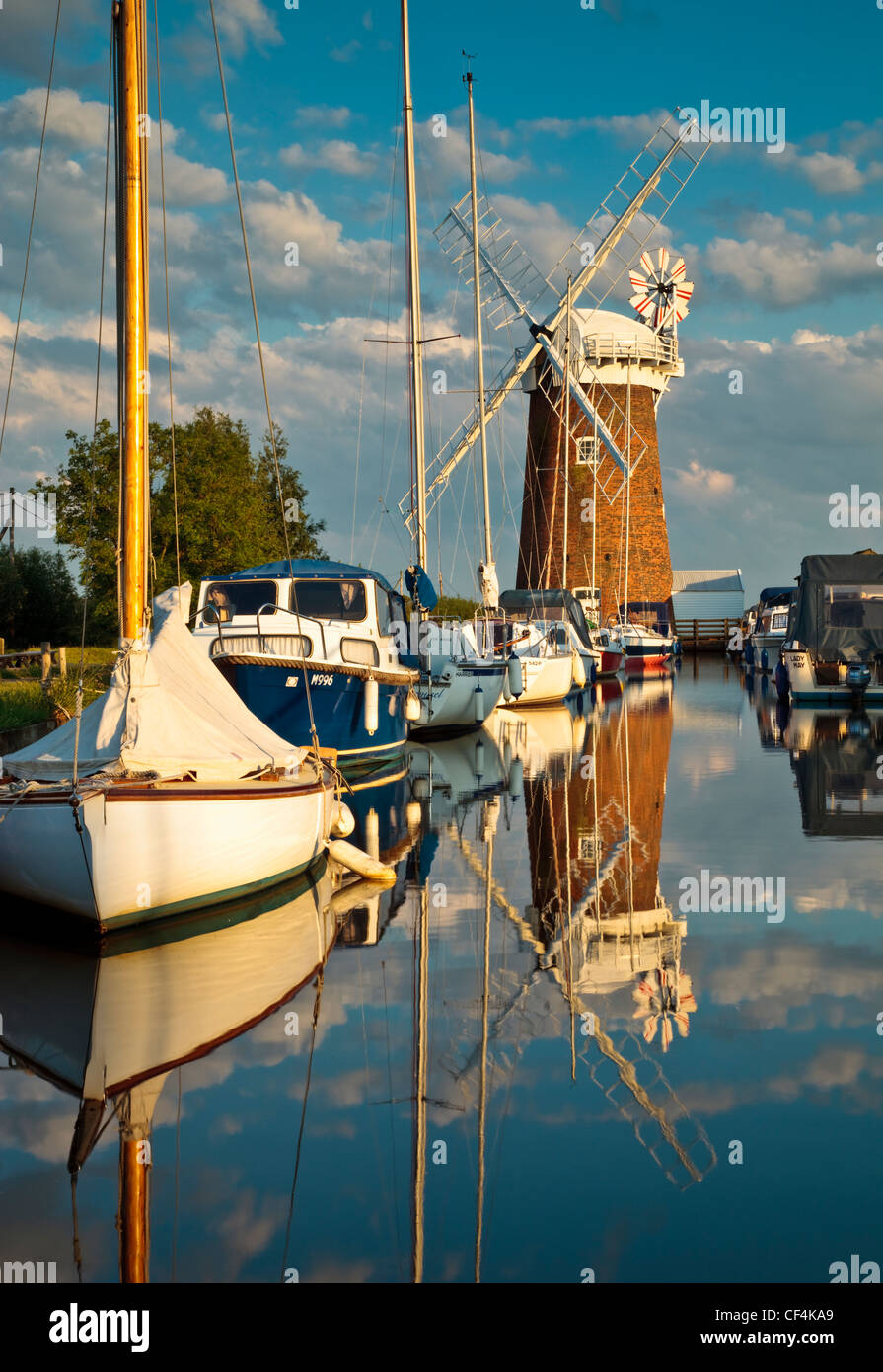 Relections of Horsey Windpump and boats in Horsey Mere on the Norfolk ...
