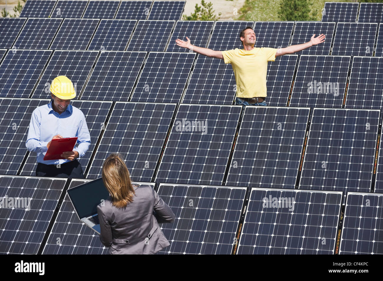 Germany, Munich, Engineer with man and woman in solar plant Stock Photo ...