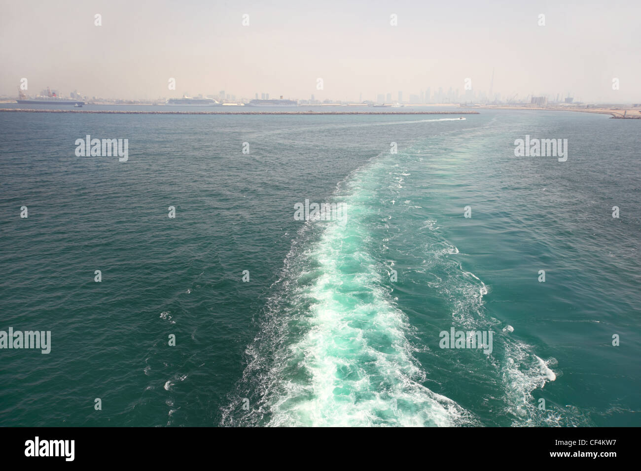 ship trail with waves and foam in ocean general view on horizon Stock ...