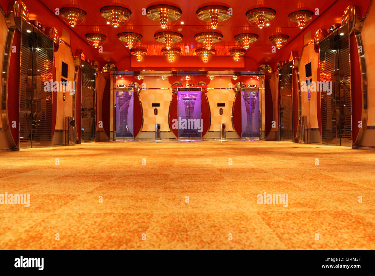 modern luxury hall with bright red ceiling and lifts front view Stock ...