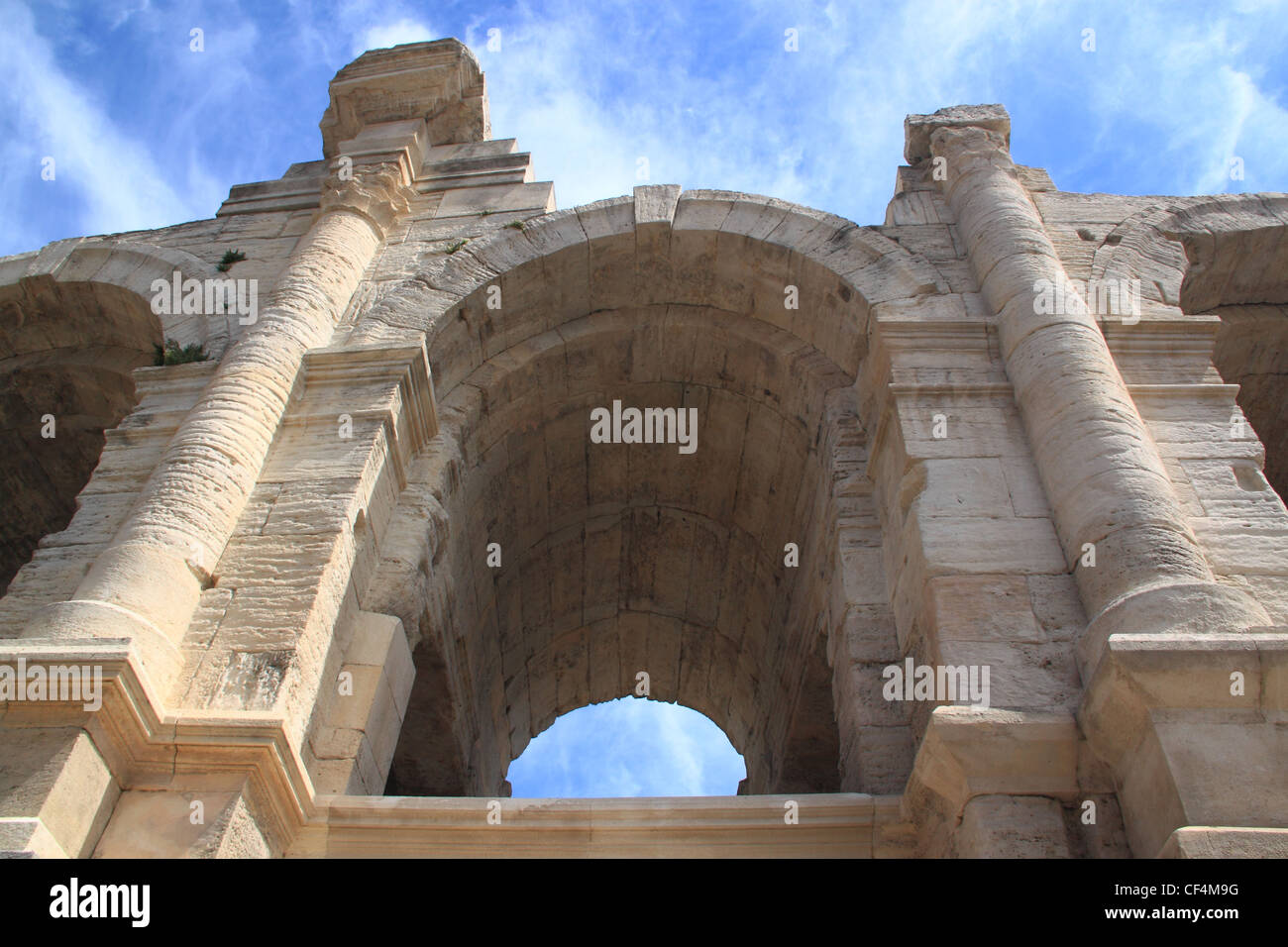 Ancient roman arch on a blue sky background Stock Photo - Alamy