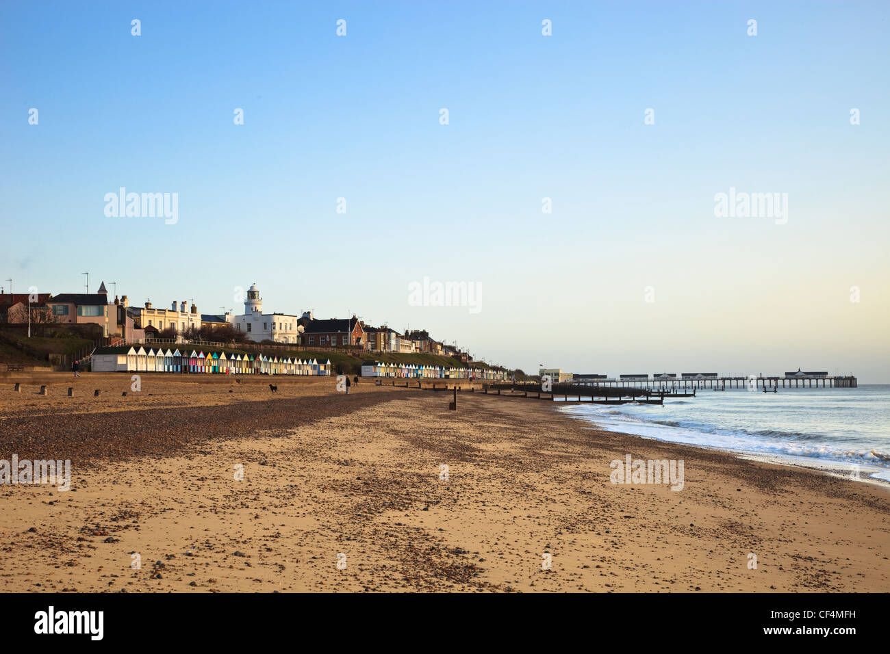 A view along the sandy beach at Southwold featuring the famous beach ...