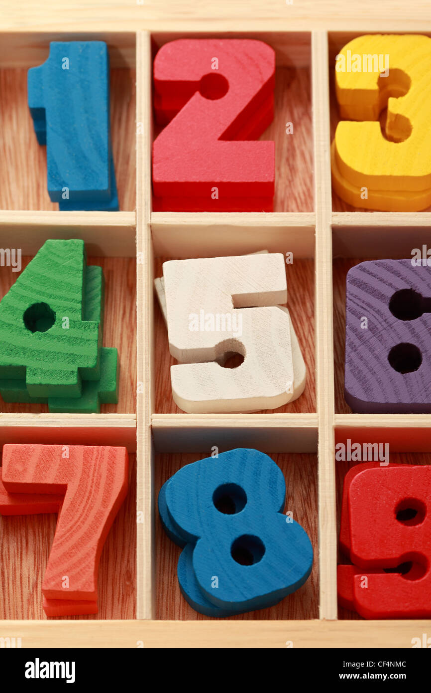 math game for junior age with colored wooden signs of numbers vertical ...