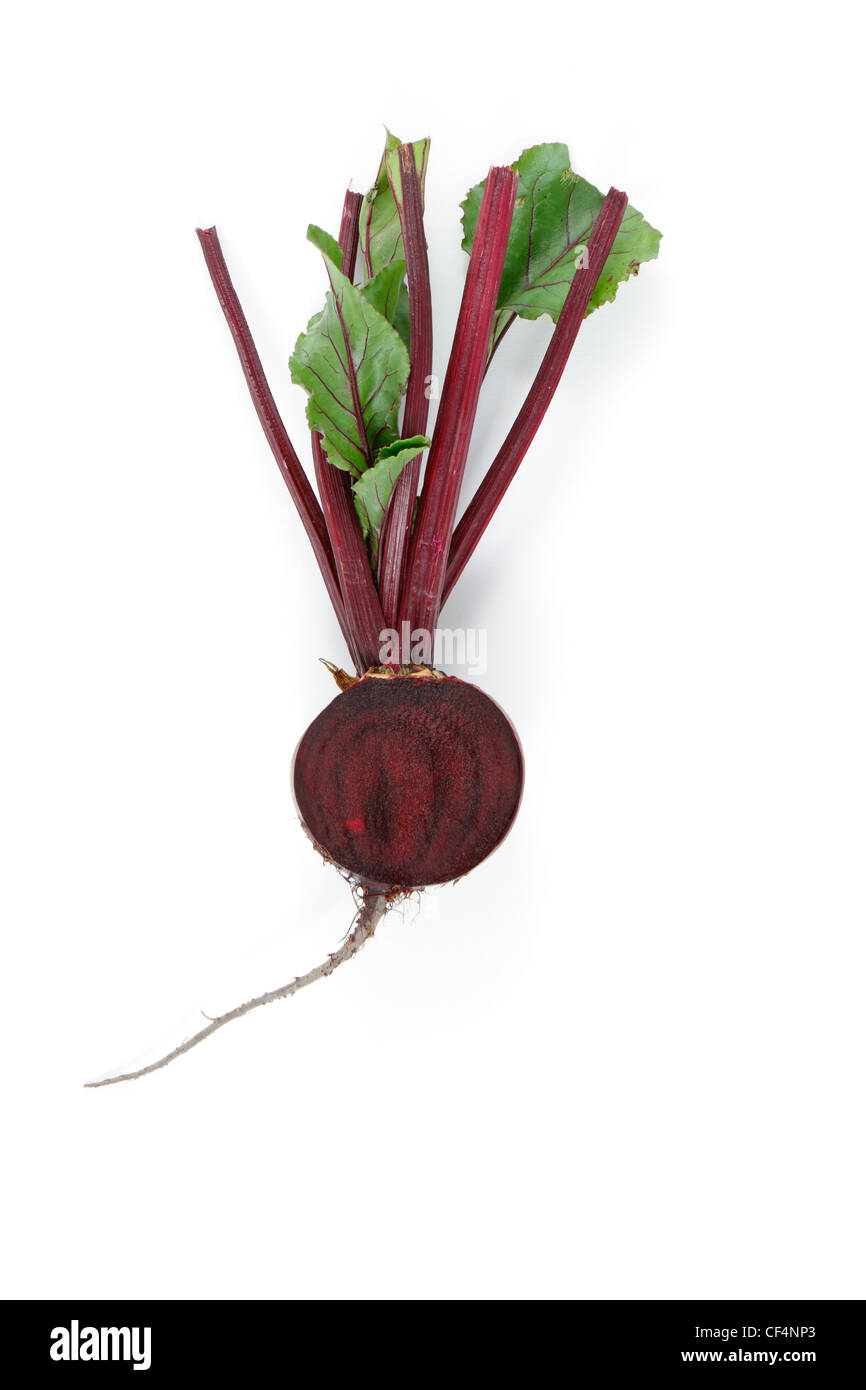 Halved beetroot with stems and leaves on a white background Stock Photo ...