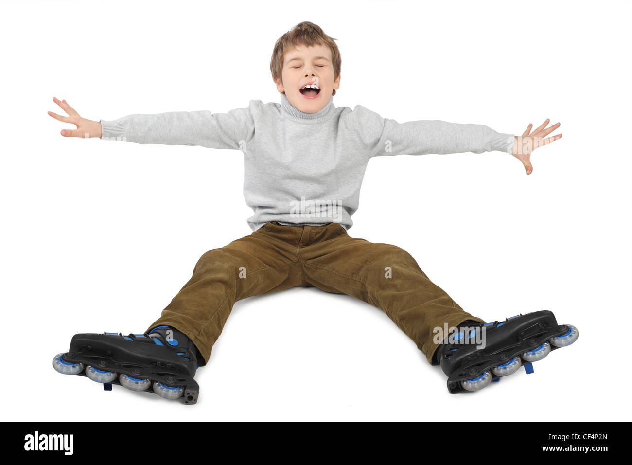 little roller boy sitting with hands moved at sides and crying isolated ...
