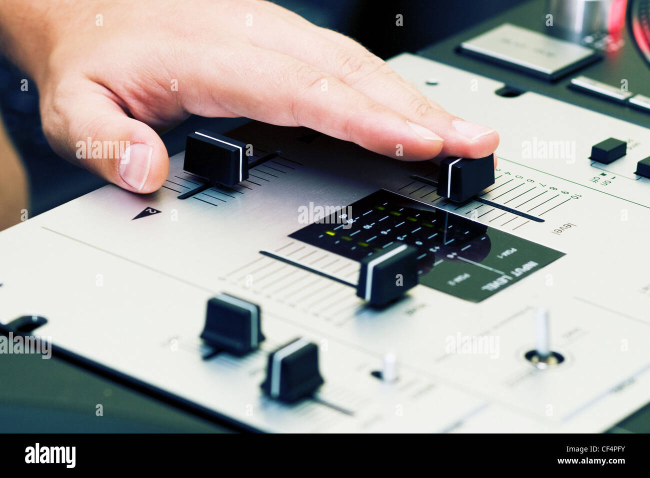Hand of a disc jockey on the professional mixing controller Stock Photo ...