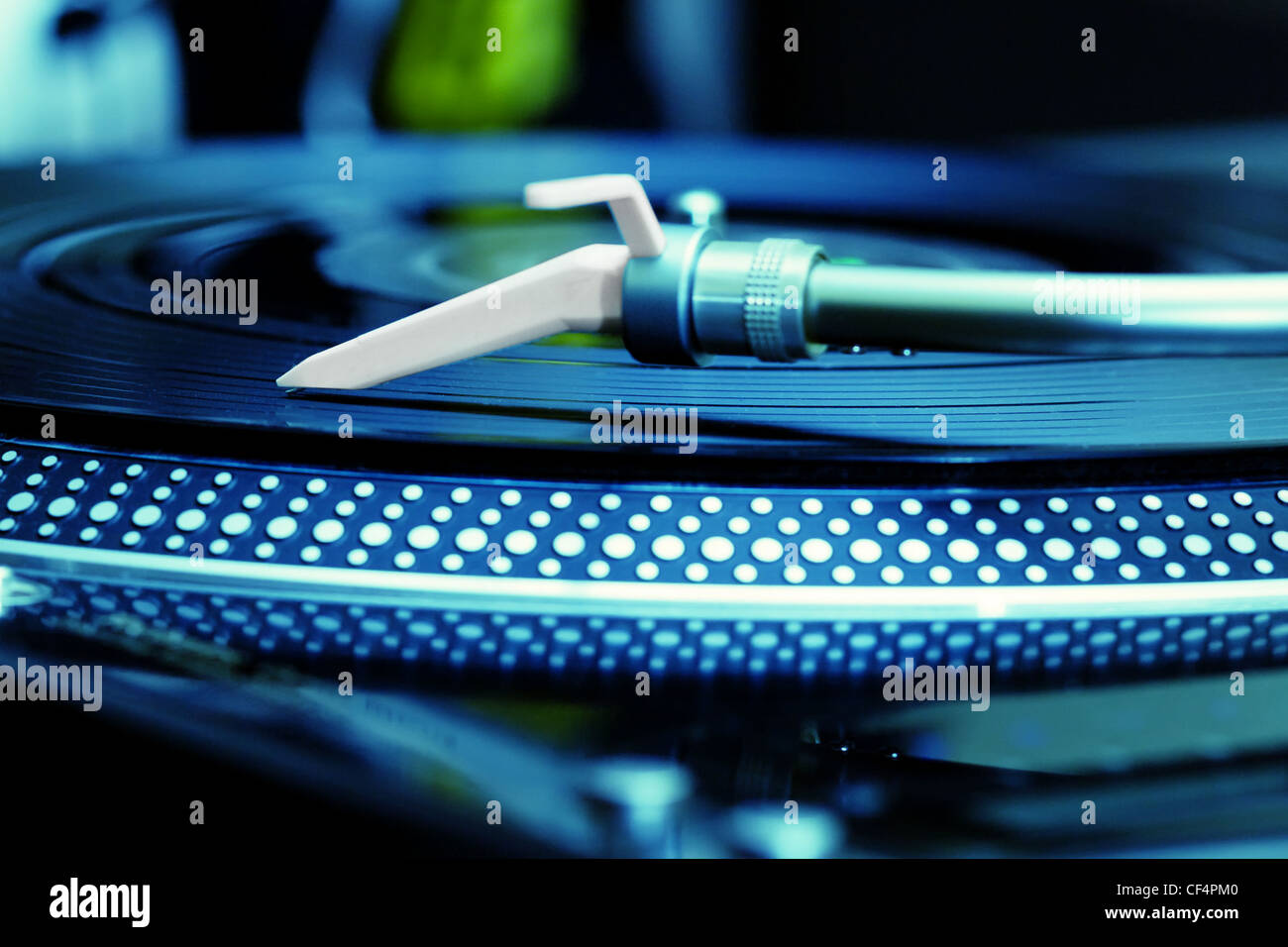Analog record player spinning the disc with music Stock Photo - Alamy
