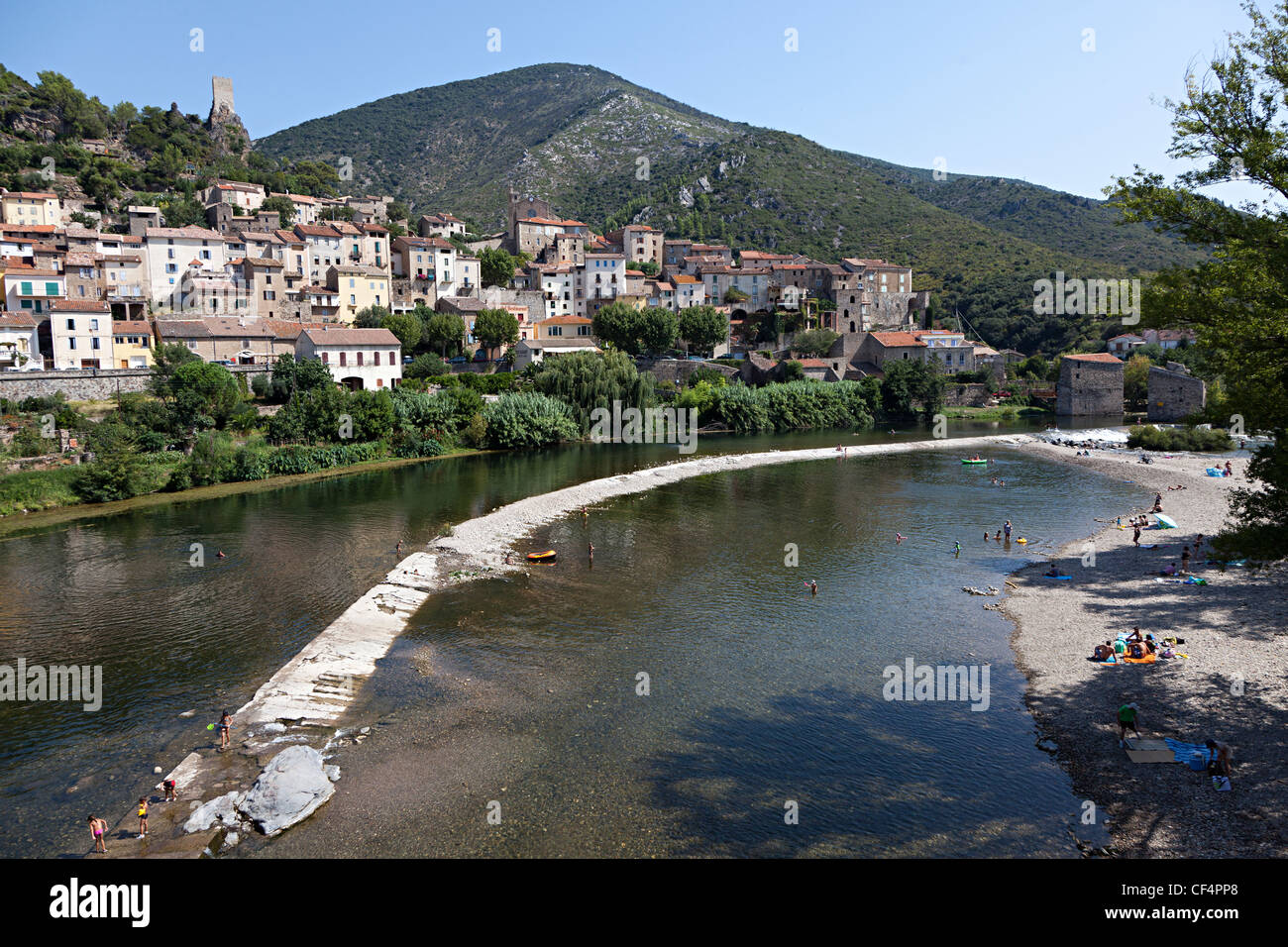 River Orb at Roquebrun with Carolingian tower on skyline, Herault Languedoc Roussillon, France ...
