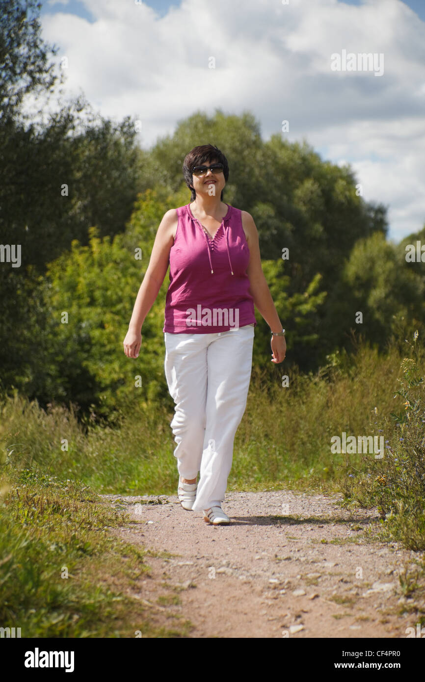 Woman clearing pathway hi-res stock photography and images - Alamy