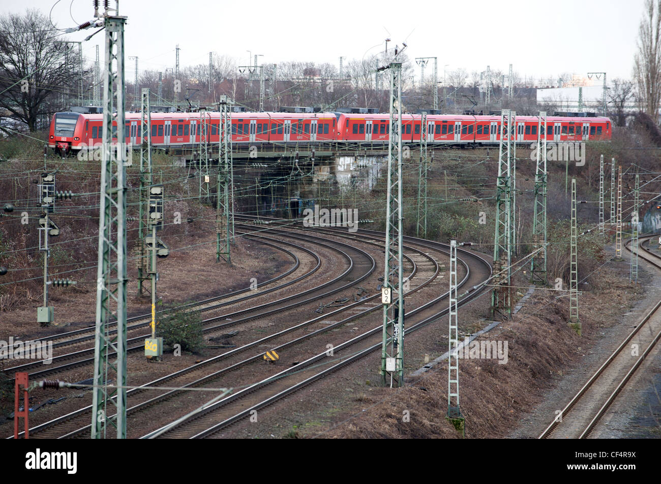 Local passenger train on a elevated loop around the city of Cologne ...