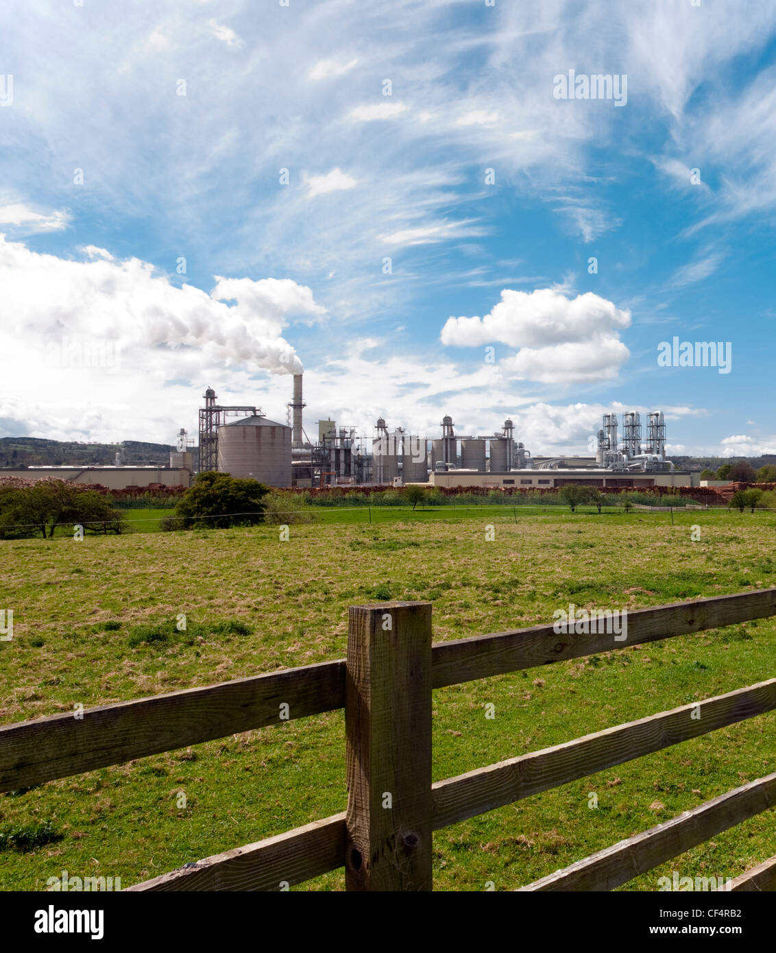 A manufacturing plant surrounded by lush green countryside Stock Photo ...