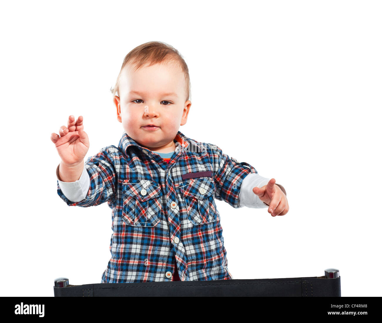 Baby looks as conductor on white background Stock Photo - Alamy