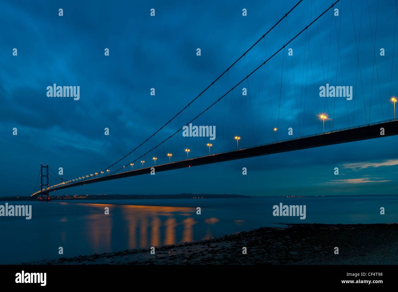 The Humber Bridge spanning the Humber Estuary at dusk. The bridge is ...