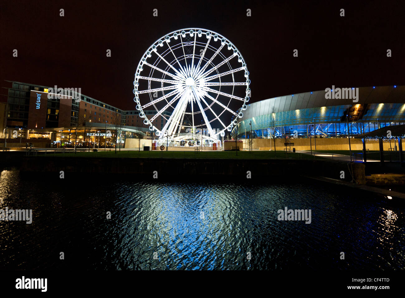 Night view of Echo Arena and Echo Liverpool Wheel reflected in the ...