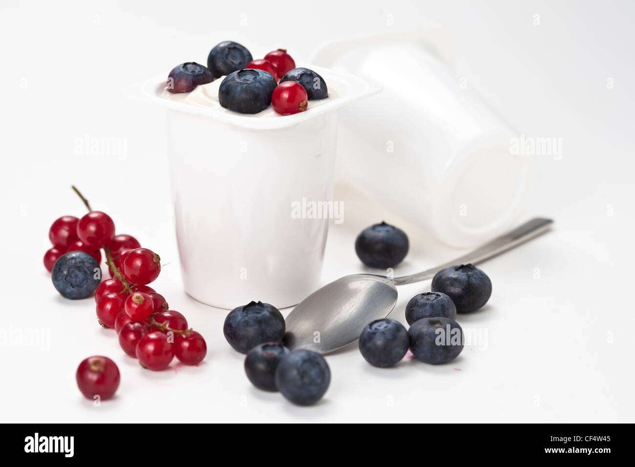yogurt in plastic box container over white background Stock Photo - Alamy