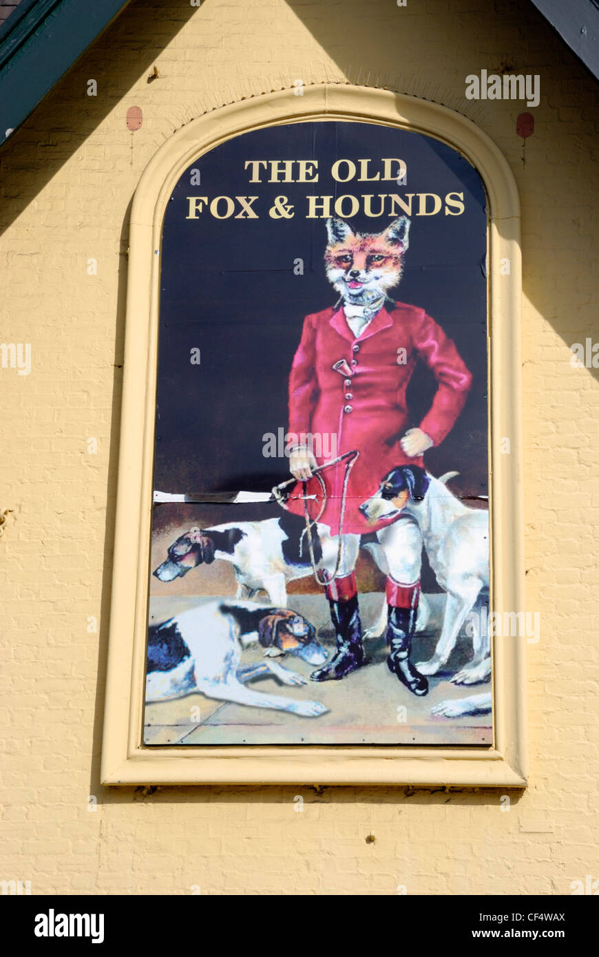 A pub sign on a wall outside The Old Fox and Hounds pub in Croydon ...