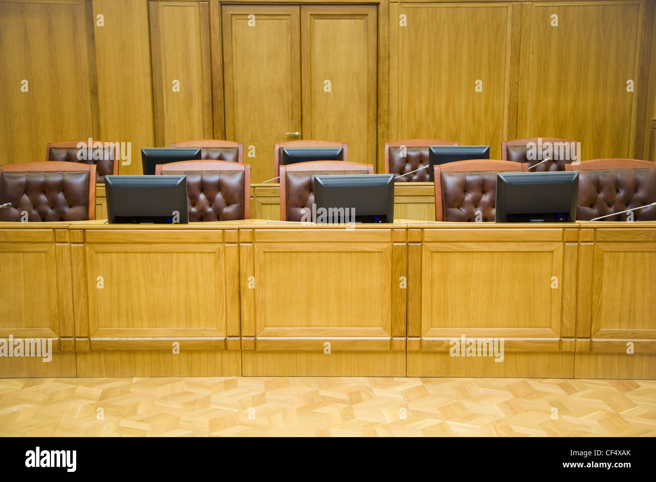 Conference halls with magnificent leather armchairs and wooden tables ...