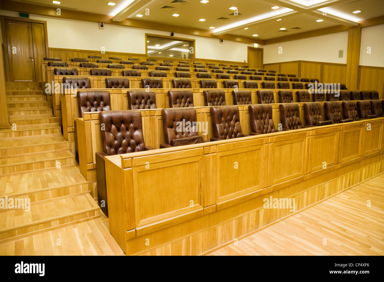Conference halls with magnificent leather armchairs and wooden tables ...