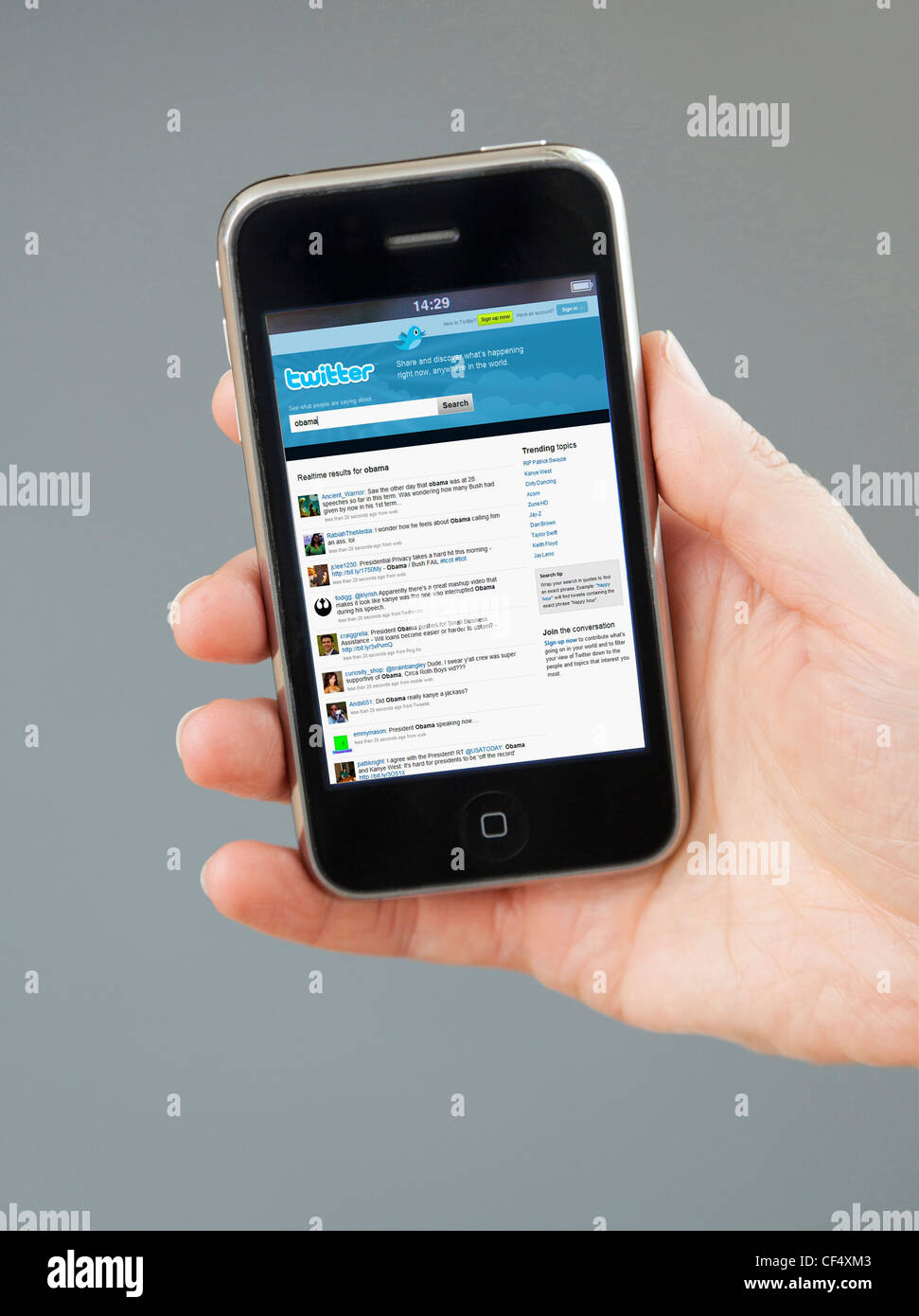 using Twitter on iPhone Stock Photo - Alamy