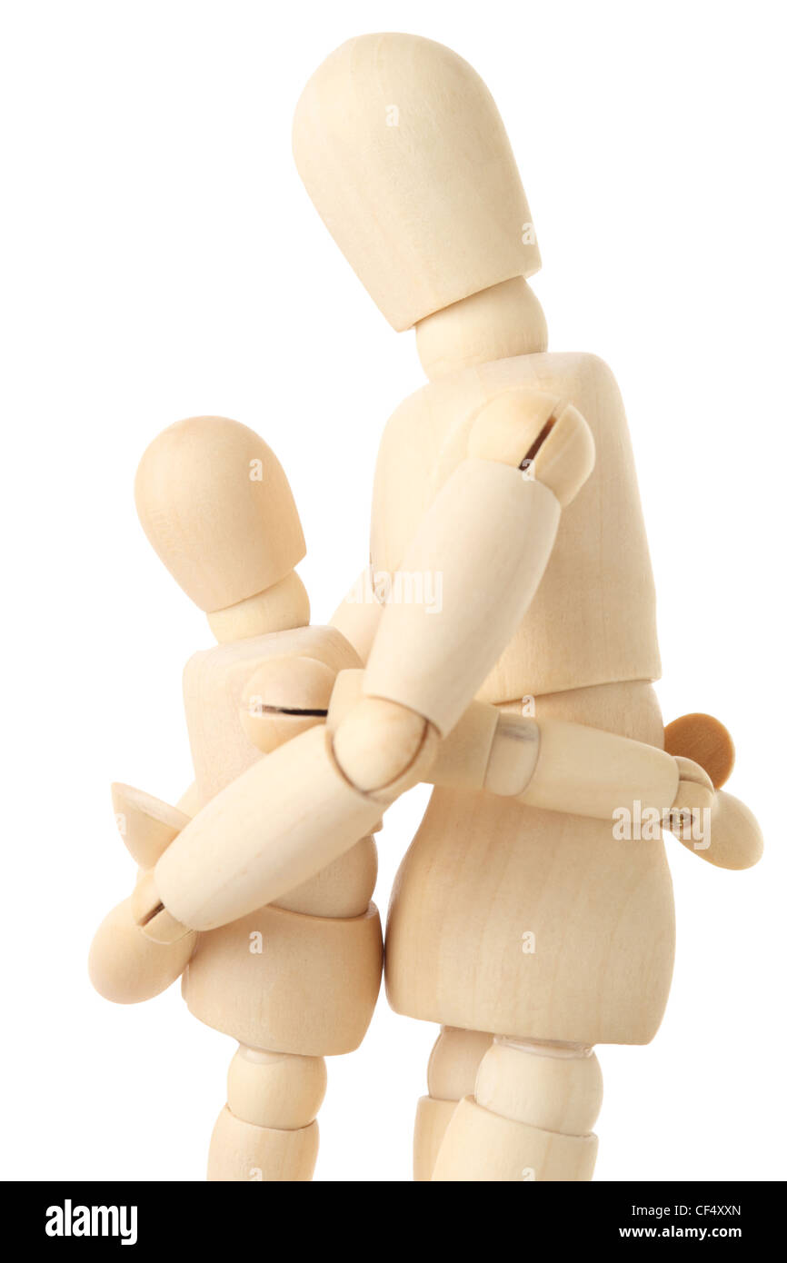wooden figures of parent embracing his child, half body, side view ...