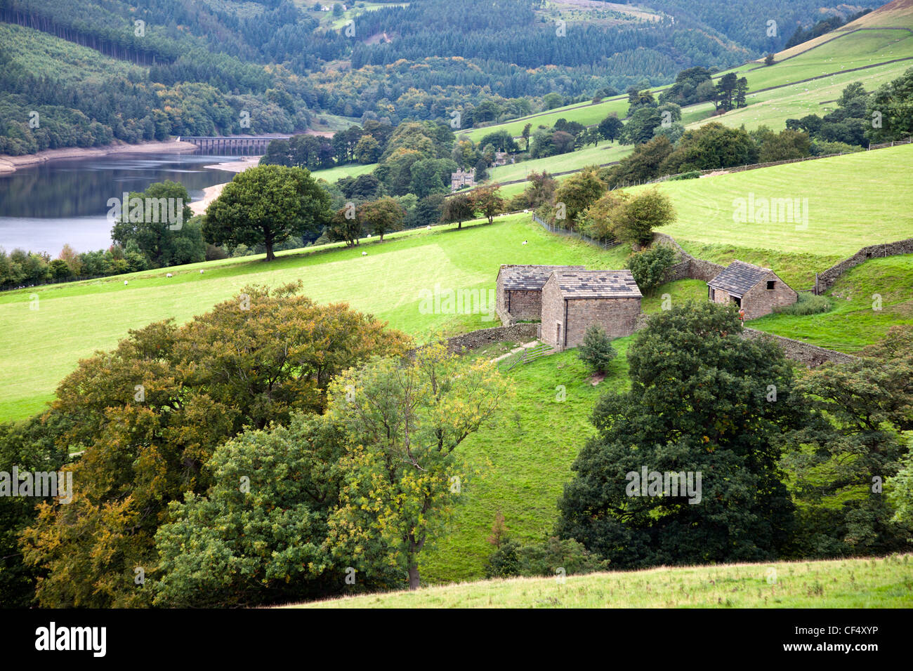 small stone buildings set in the Derbyshire countryside with reservoir ...