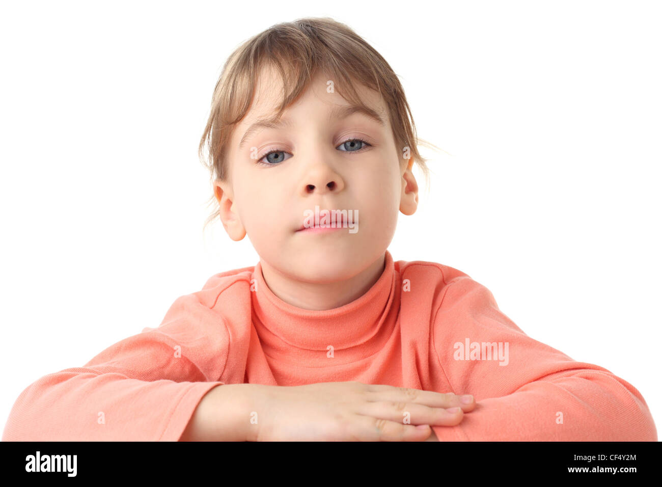 portrait of serious little girl in thin sweater, half body, isolated on ...