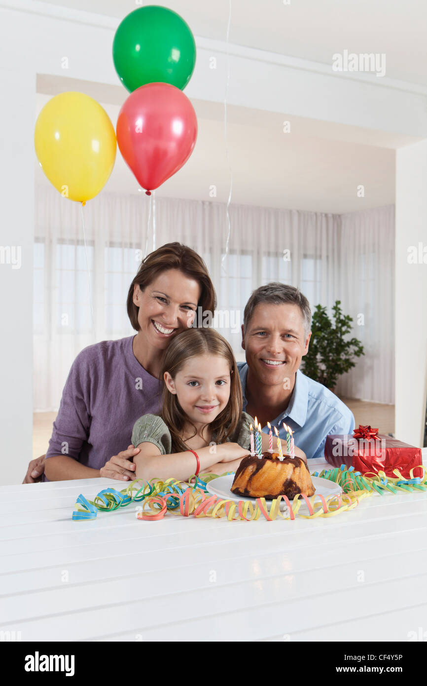 Germany, Munich, Family celebrating birthday, smiling, portrait Stock ...