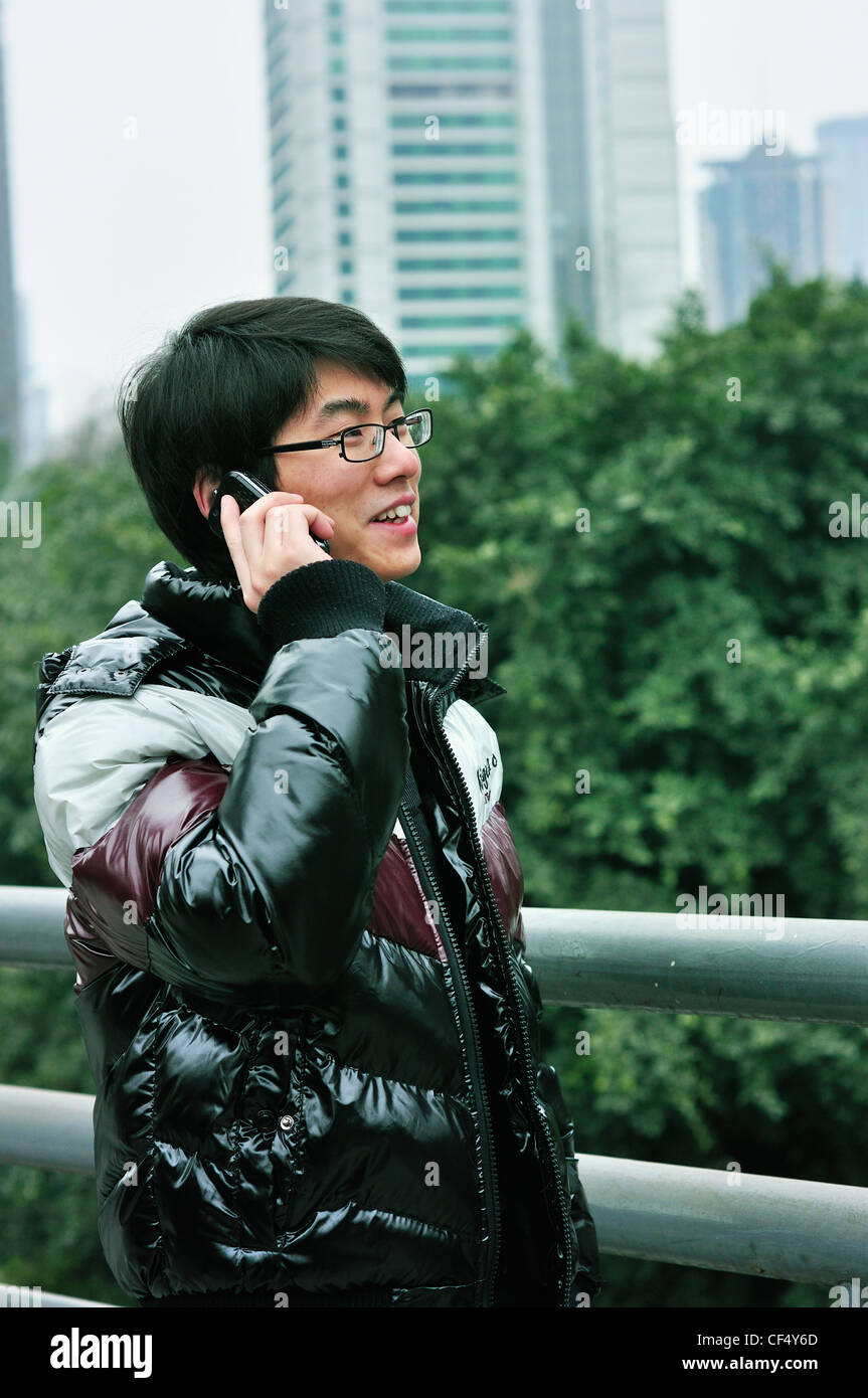 Asian iphone man holding hi-res stock photography and images - Alamy