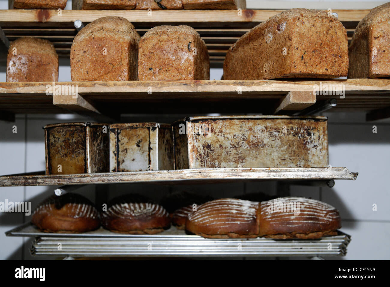 Germany, Upper Bavaria, Egling, Breads on shelf in wood stove bakery ...