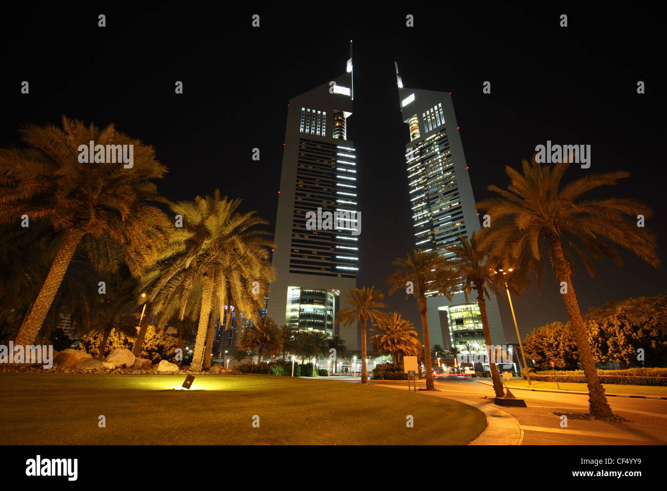 DUBAI APRIL 18 Emirates Towers area palms grass at night time 18 april ...