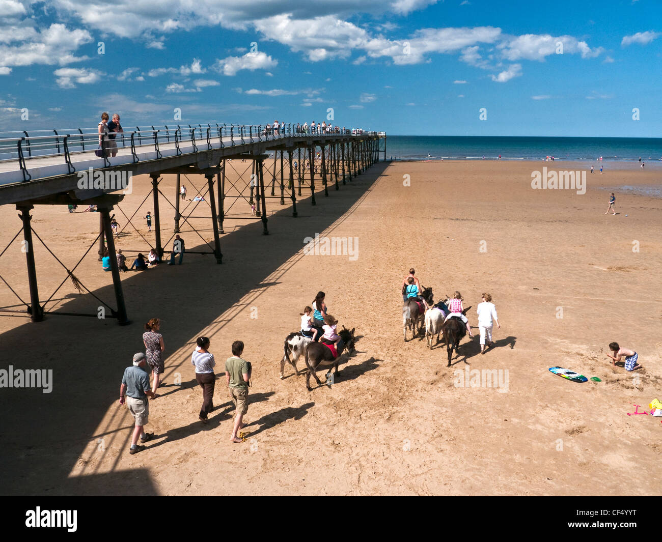 Donkey rides on the beach by the Victorian pier at Saltburn-By-The-Sea ...