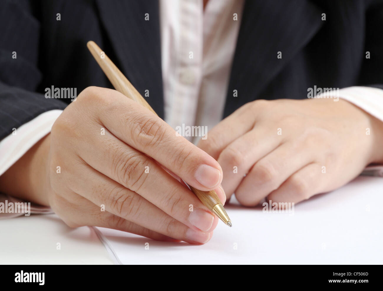 Business woman at her office signing a contract on white paper Stock ...