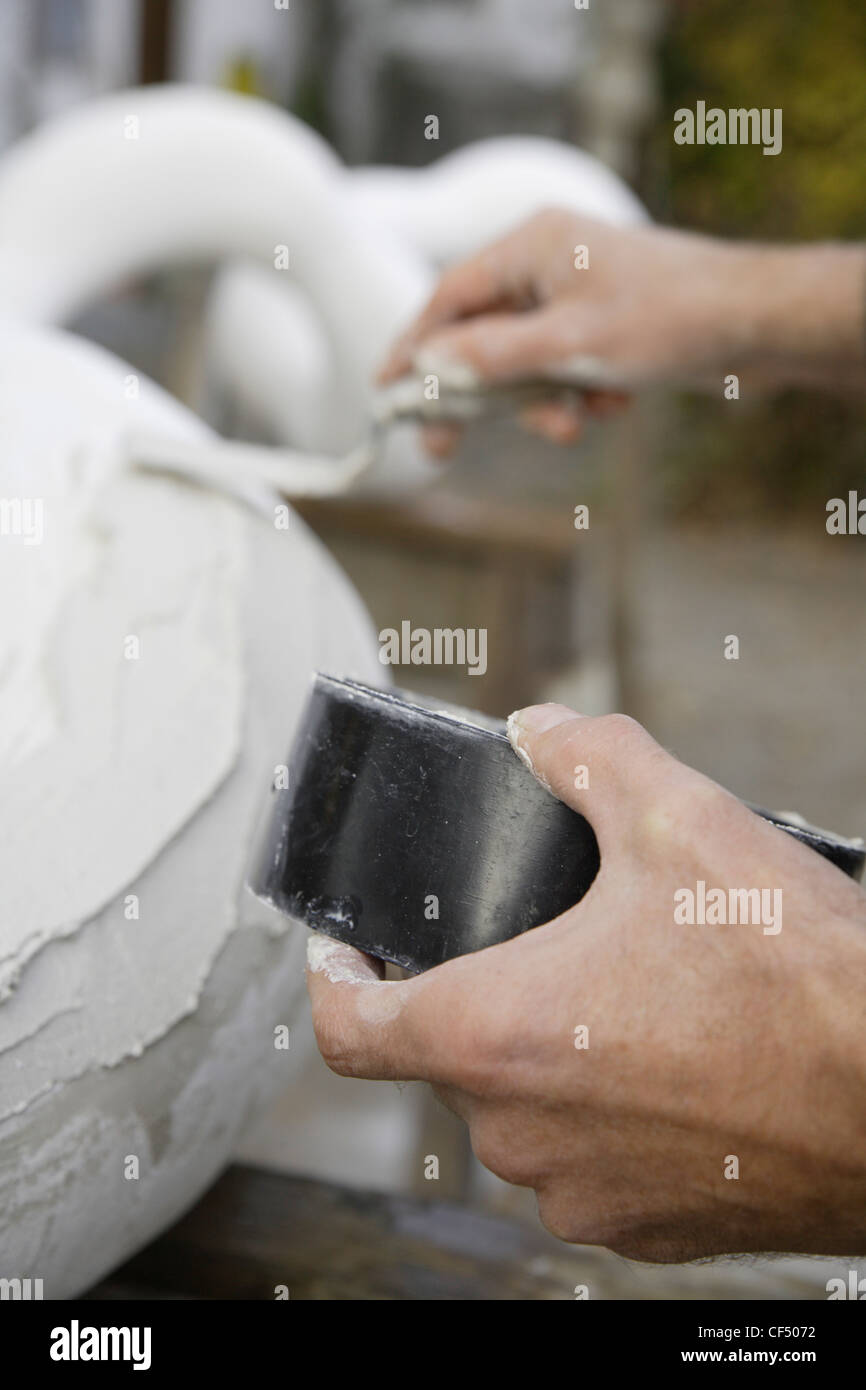 Manual worker applying plaster hi-res stock photography and images - Alamy