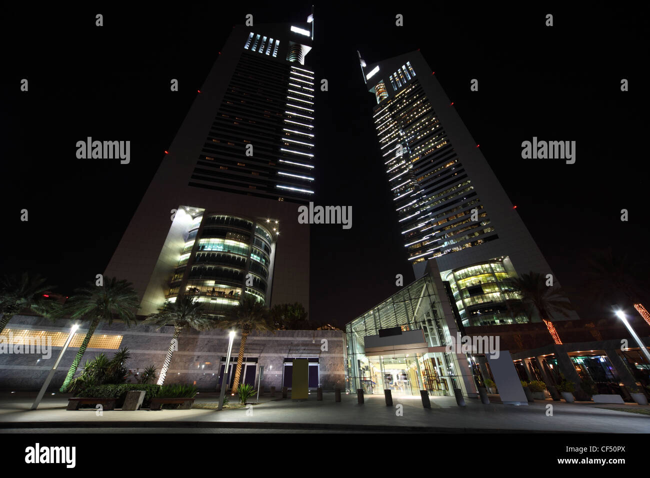 DUBAI APRIL 18 Emirates Towers area palms grass at night time 18 april ...