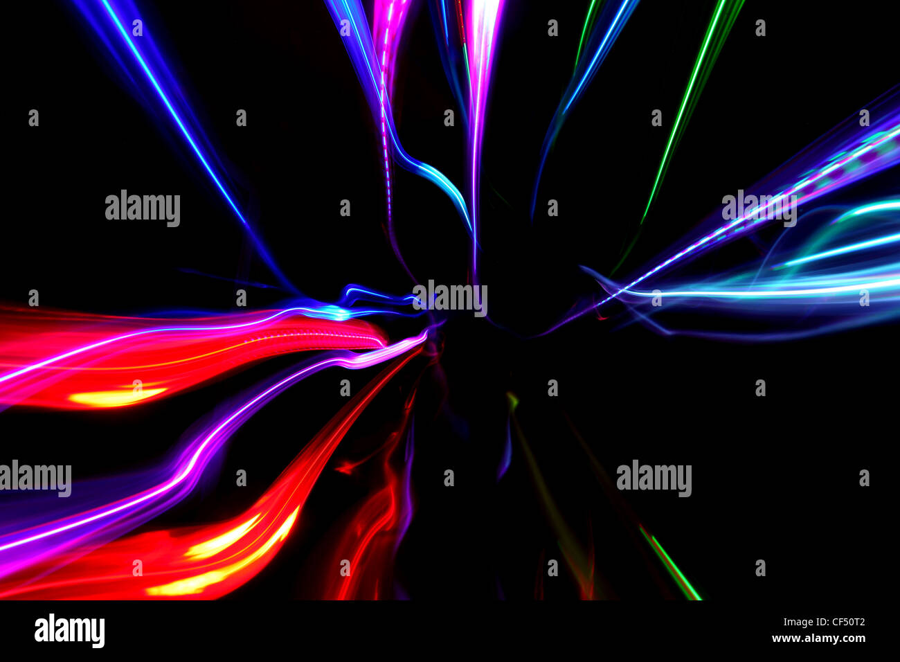 abstract background with multicolored motion blured lines on black ...