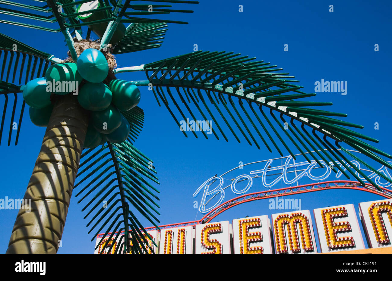 Skegness Plastic artificial Palm Tree with amusement arcade behind in ...