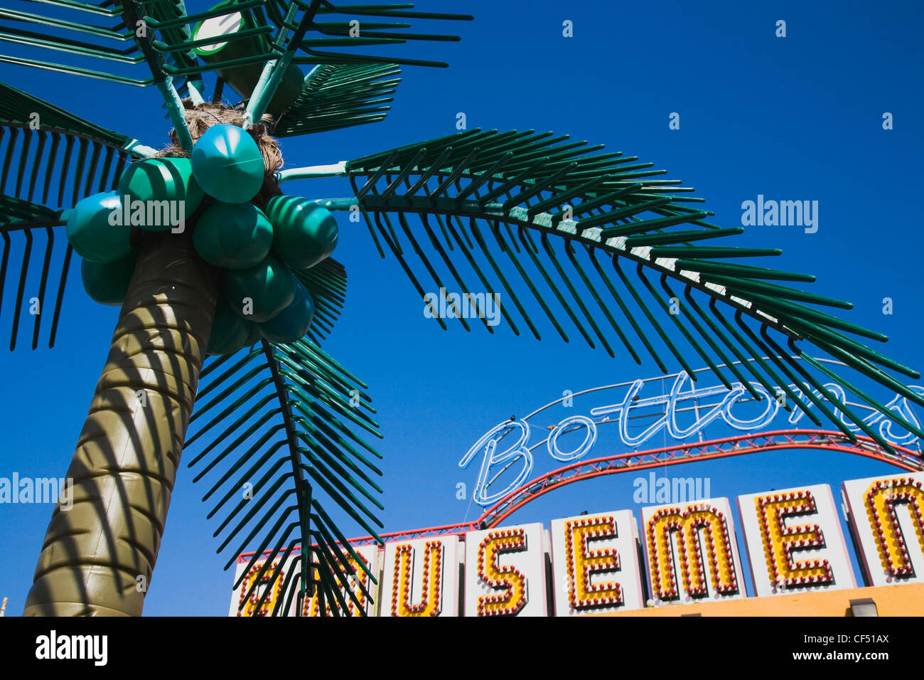 Skegness Plastic artificial Palm Tree with amusement arcade behind in ...