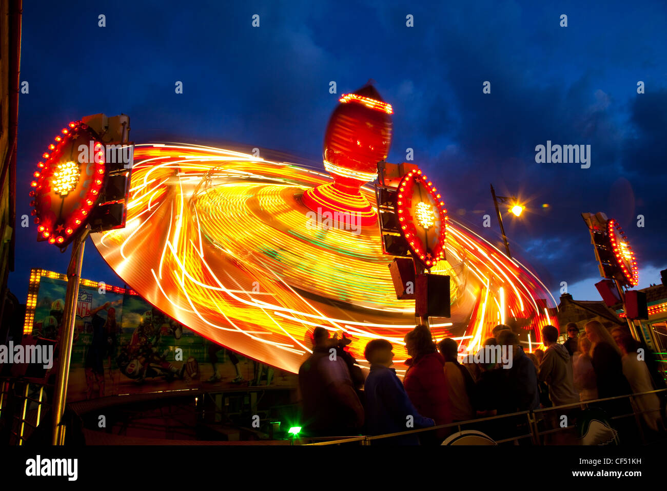 People queuing for a fairground ride at Stokesley fair, held in the ...