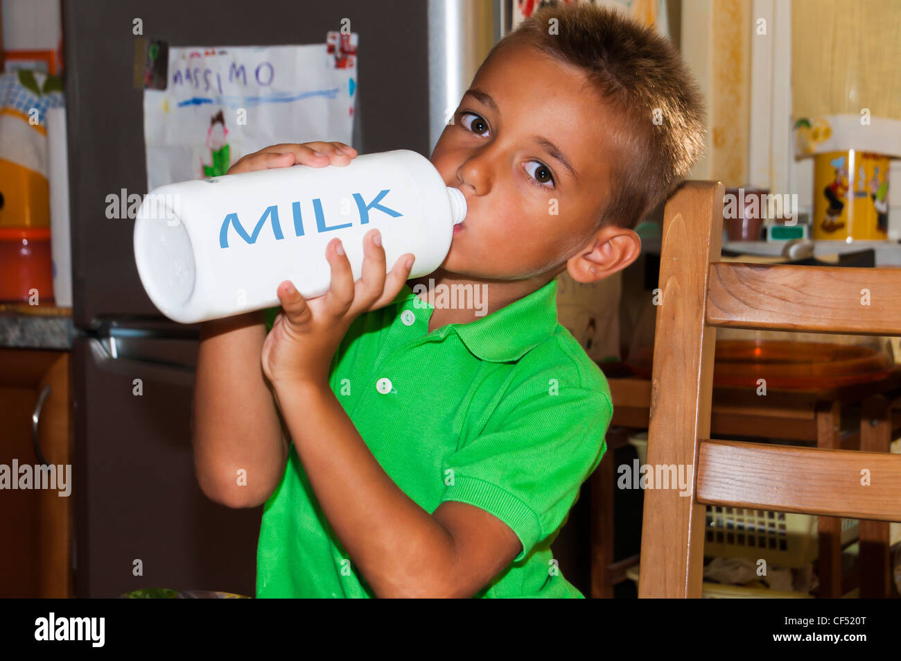 Little boy drinking milk.shot taken in the kitchen Stock Photo - Alamy