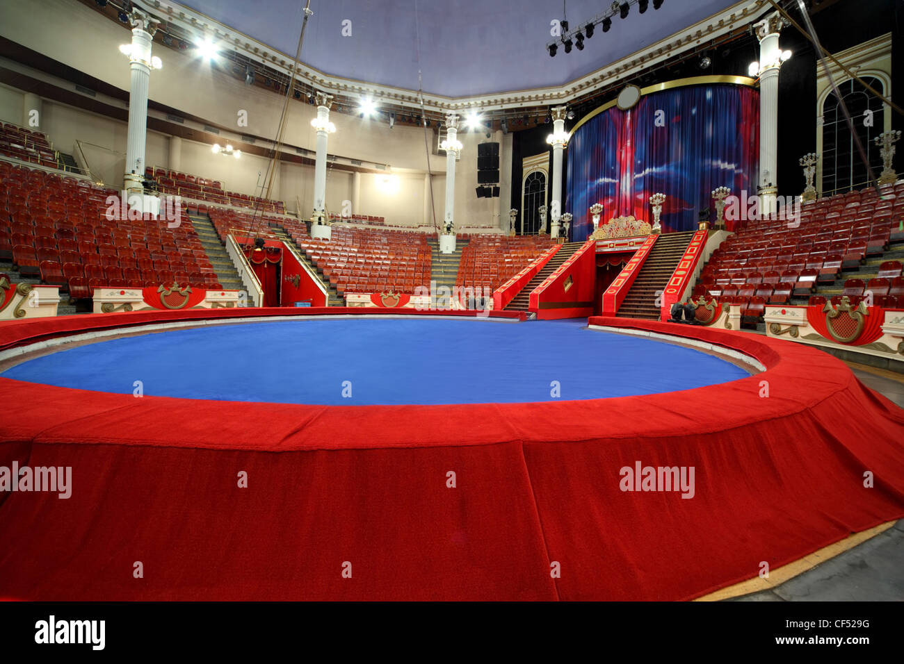 blue circle arena and columns in circus white lamps turned on, camera ...