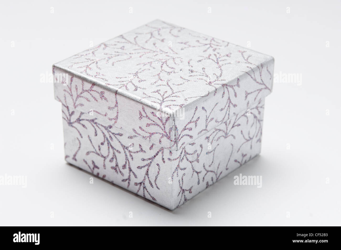 Leafy sequined Gift Box, pictured on plain white background Stock Photo ...