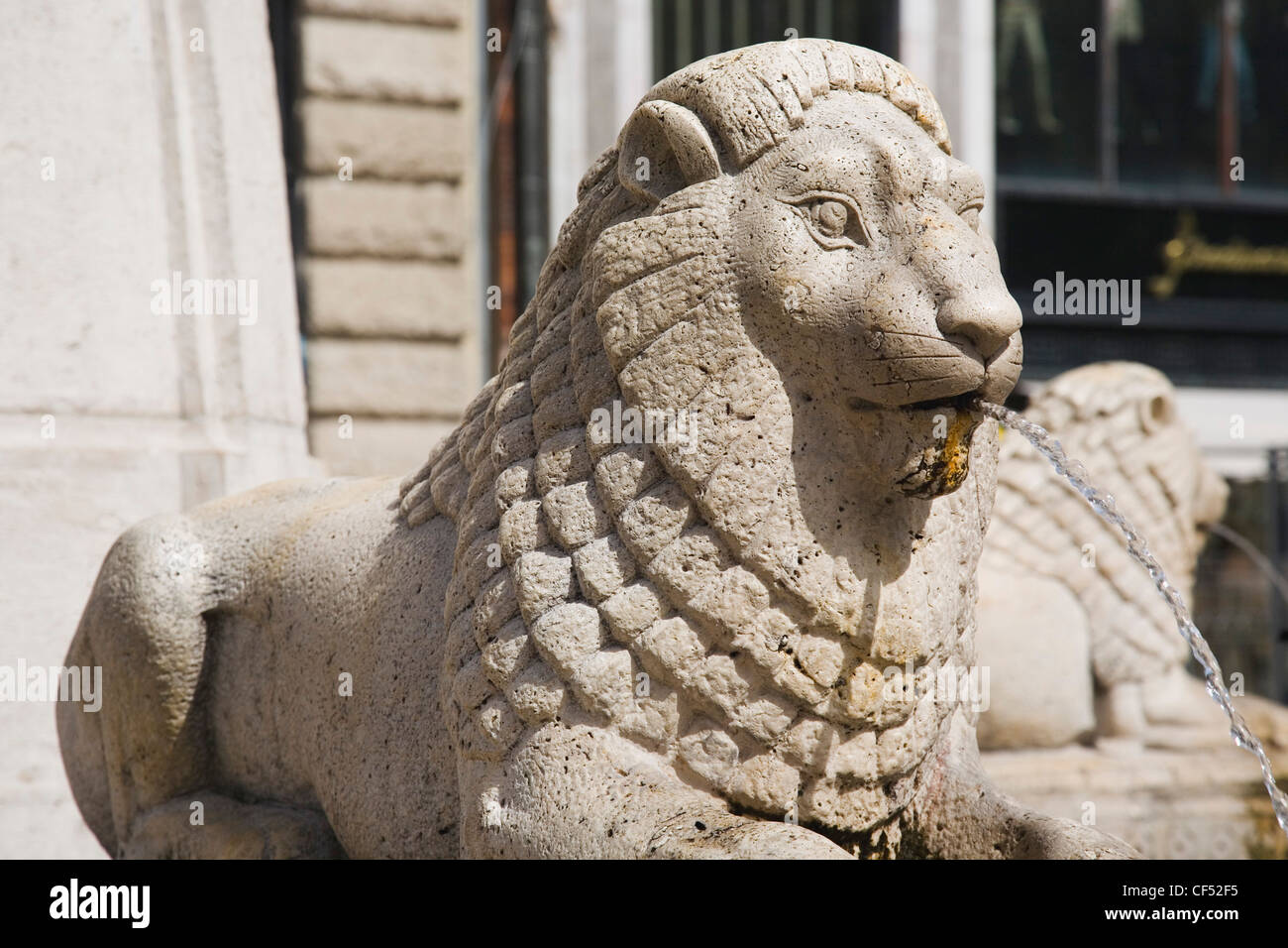 Hungary, Budapest, Lion fountain spouting natural spring water in ...
