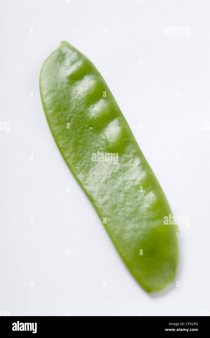 Foreign Vegetables: Full length of single mange tout lying diagonally ...