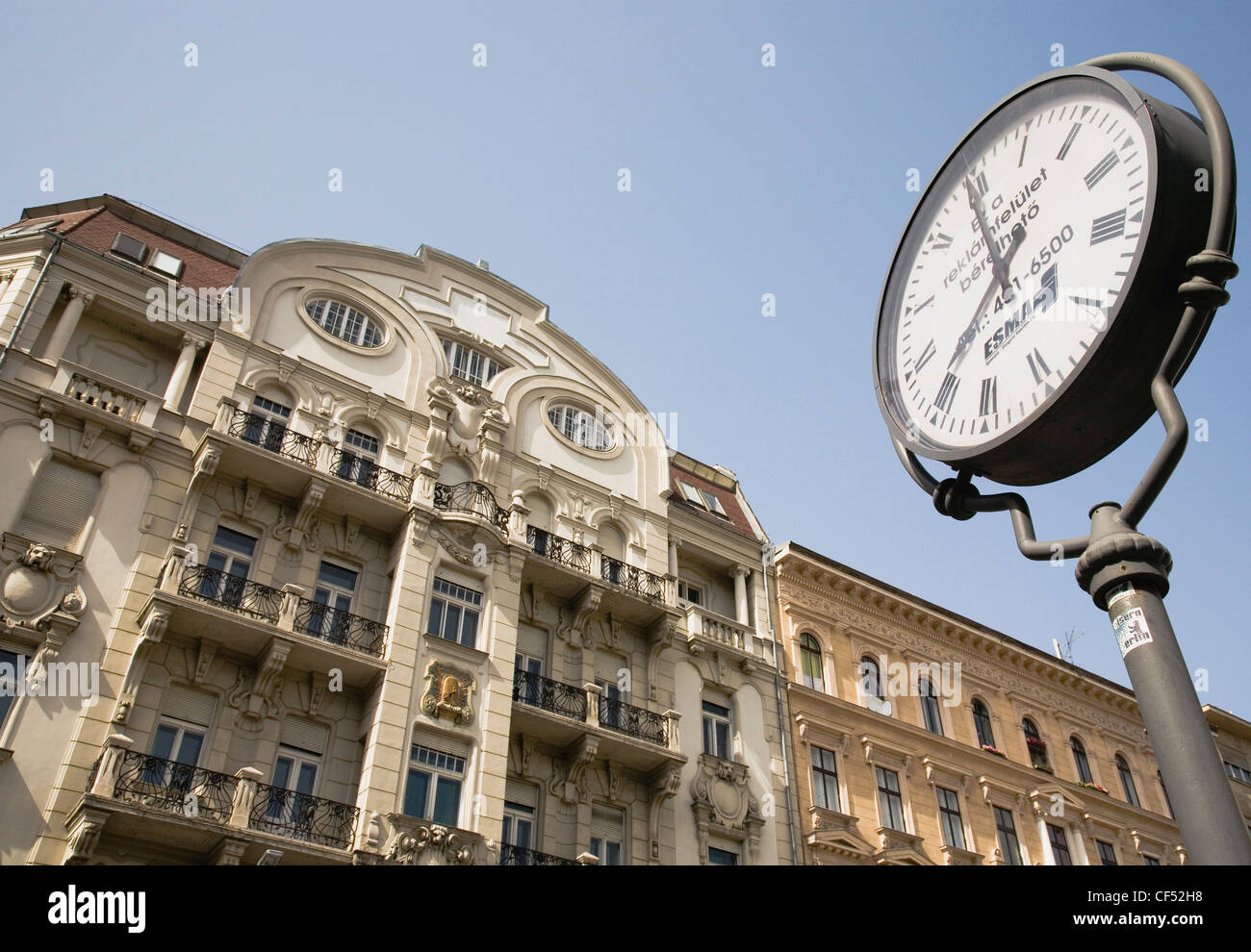 Clock with art nouveau facade behind in central pest hi-res stock ...