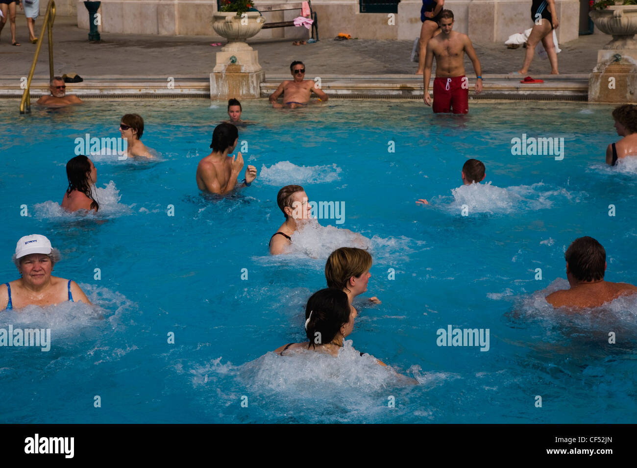 Hungary, Budapest, Pest, Mixed group outdoor bathing in summer at ...